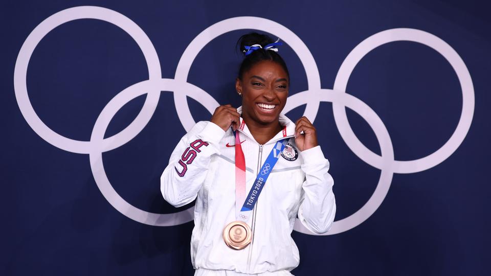 Biles wins bronze as she makes triumphant return to Olympics
