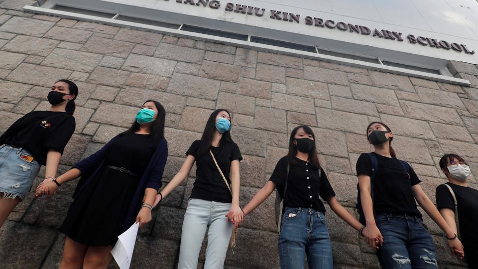 Hong Kong school students form human chain after weekend of protests